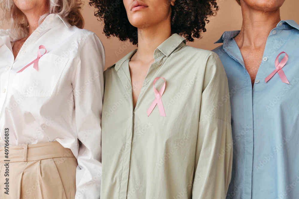 Women with simbol of Breast Cancer Awareness Day. Stock Photo | Adobe Stock