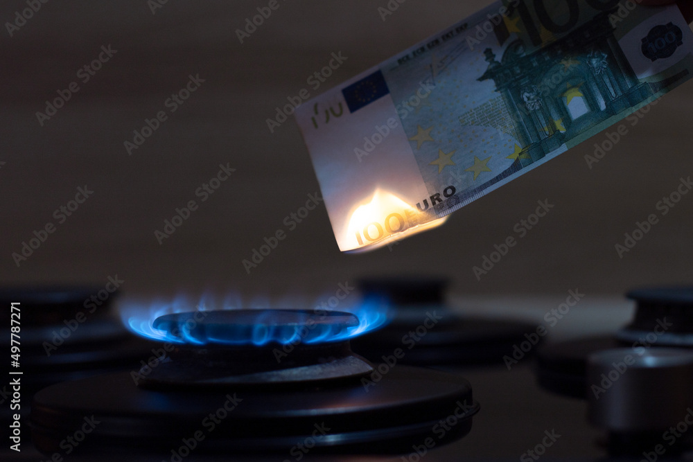 100 euro banknote burns on a gas stove, expensive gas and energy in ...