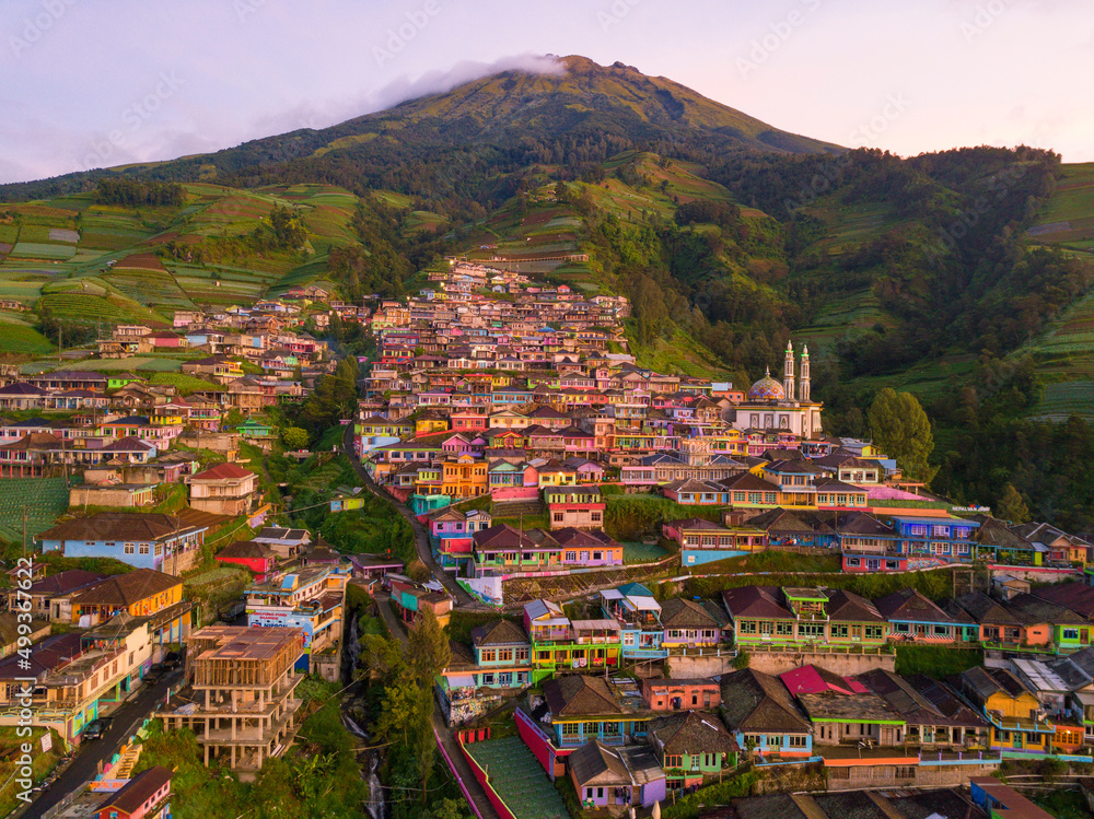 Foto Colorful painted houses in the village are built on the slopes of ...
