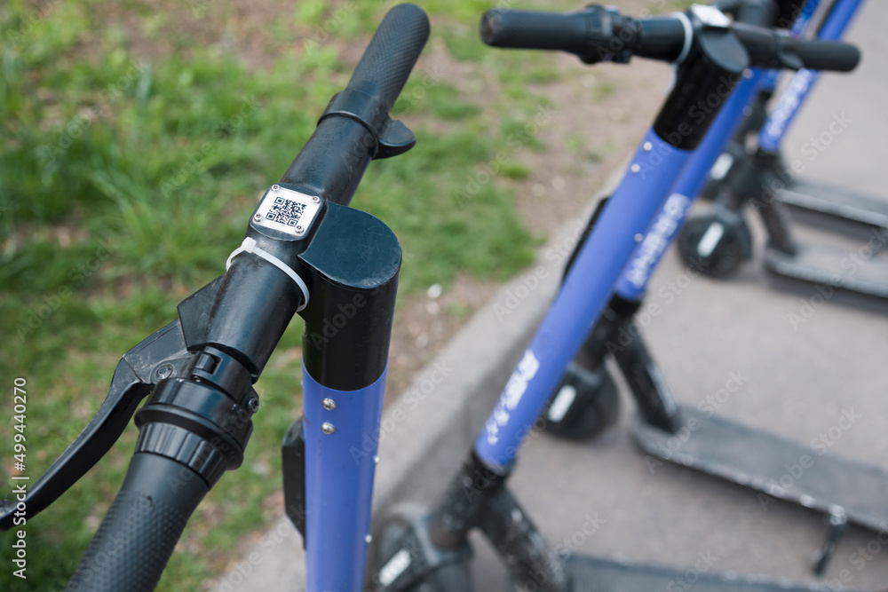 Eco-friendly transportation in city . QR code of an electric scooter ...