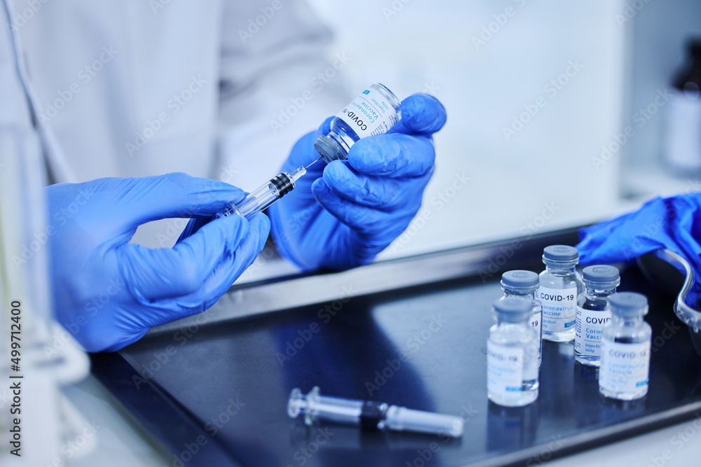 Its time to get vaccinated. Cropped shot of an unrecognizable scientist ...