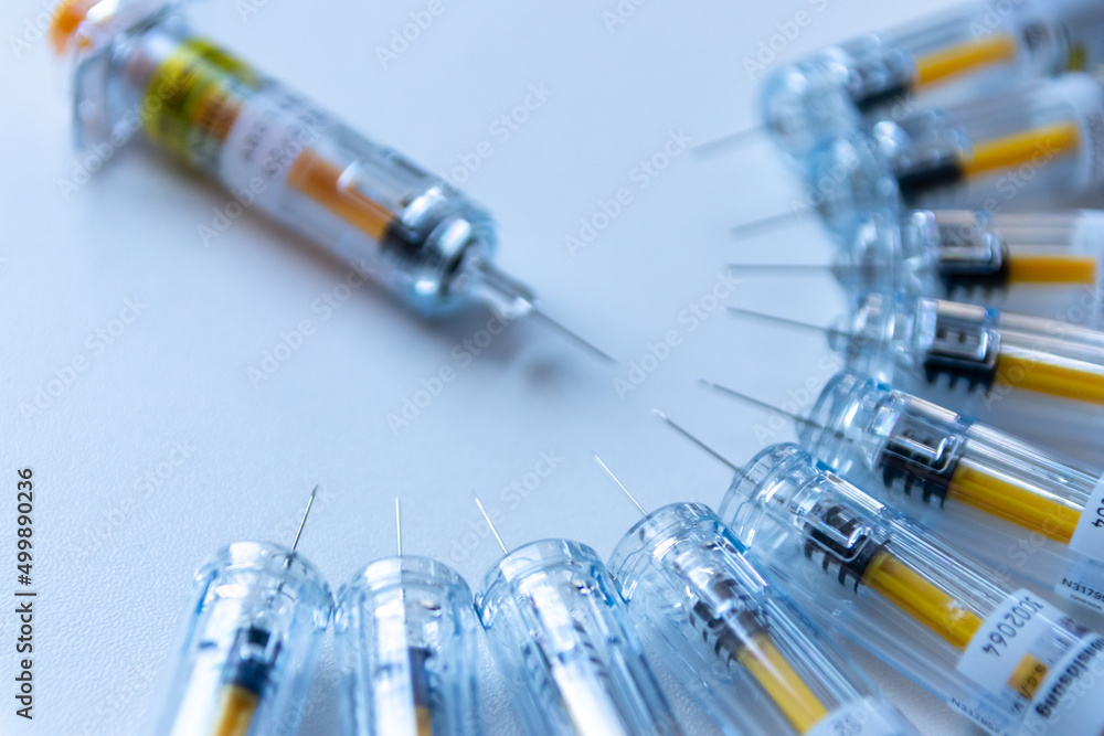 Foto de Stock New medical vaccines ready for injection with syringe and ...