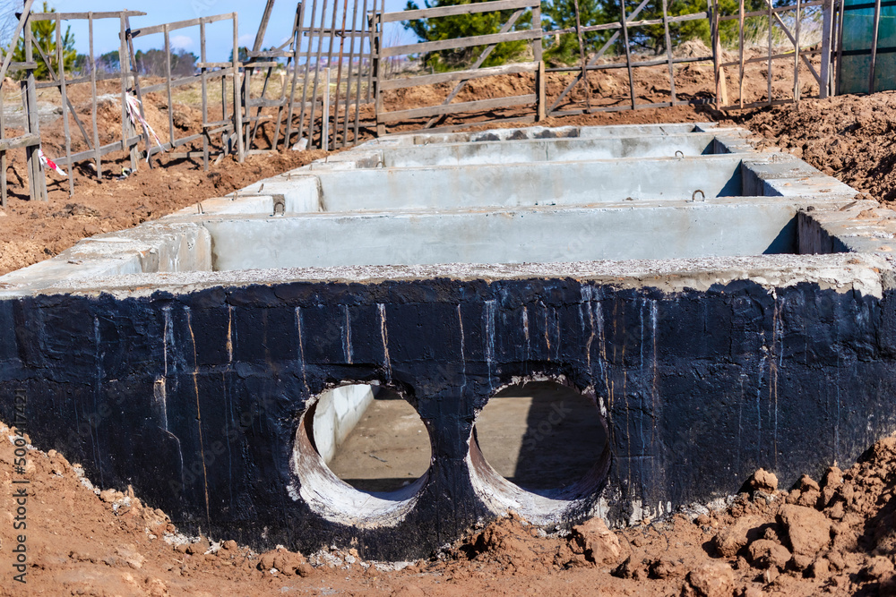 Laying of underground pipes in concrete chamber. Installation of water ...