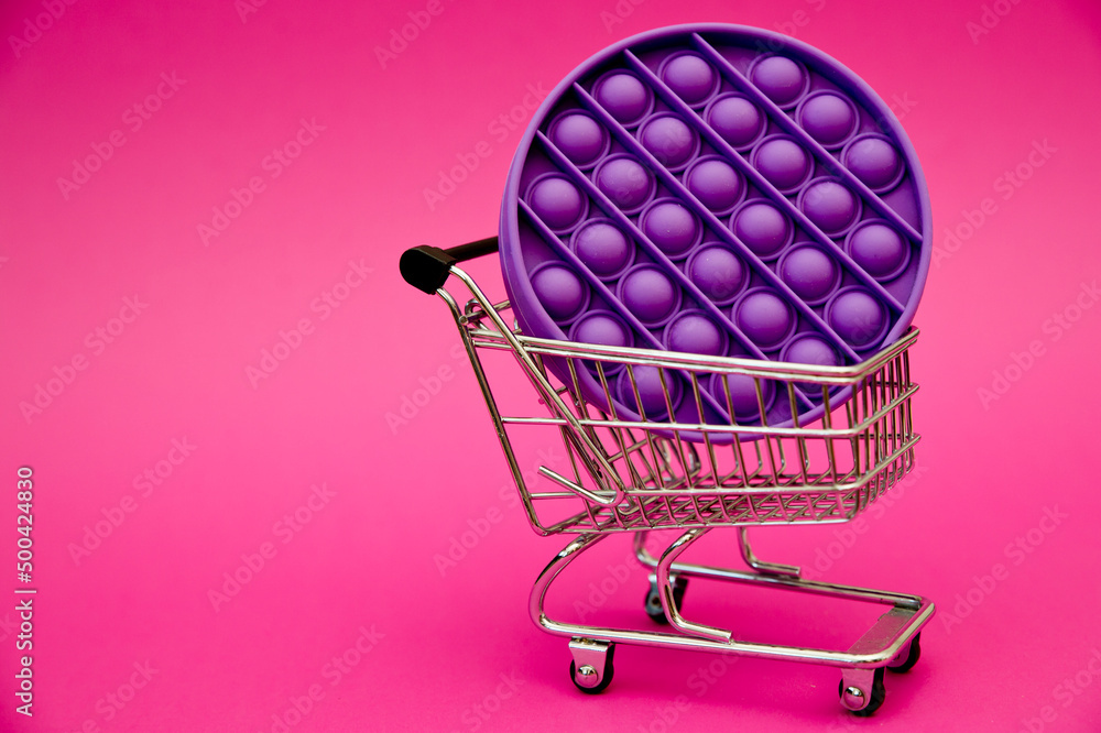 Sensory fidget toy "Pop-it". Instrument for fine motoric skils, tool to ...