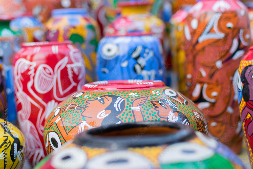 Bright colorful terracotta pots, works of handicraft, on display during ...