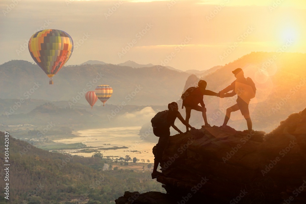 Climbing team are on the climb to the cliff,hiking and team work ...