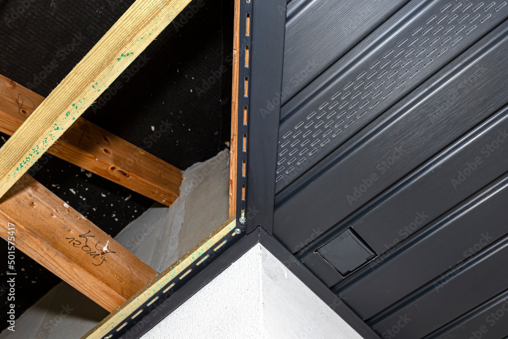Scaffolding with three rows of wooden battens and a modern graphite ...