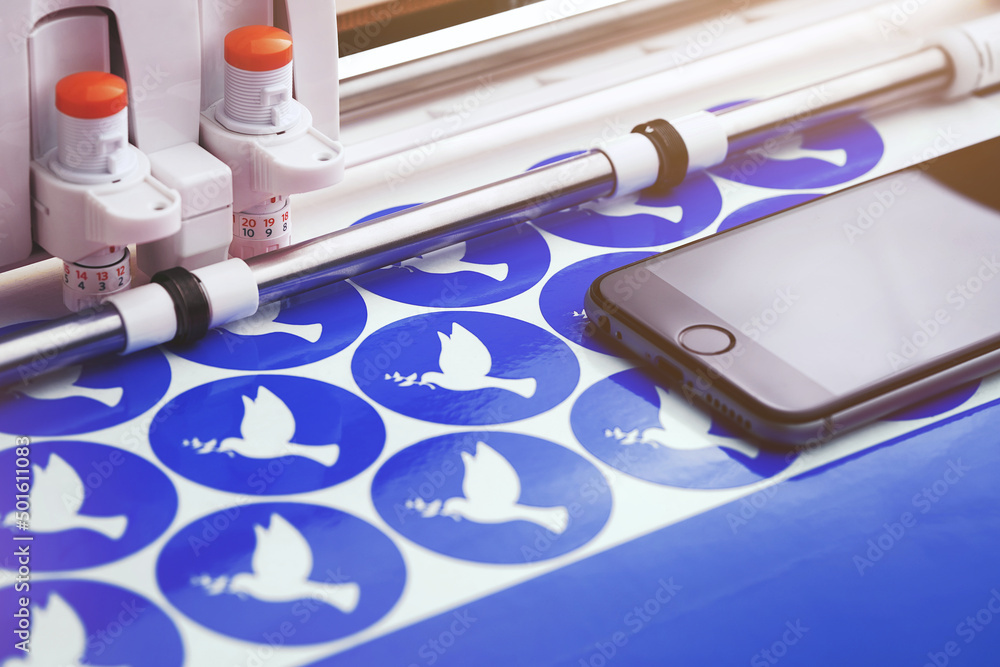 multiple round peace dove stickers are made by a plotting machine from ...
