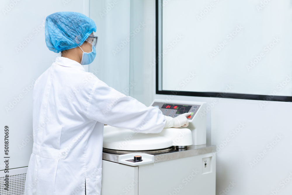 Unidentified operator is prepare the equipment to autoclave and set up ...