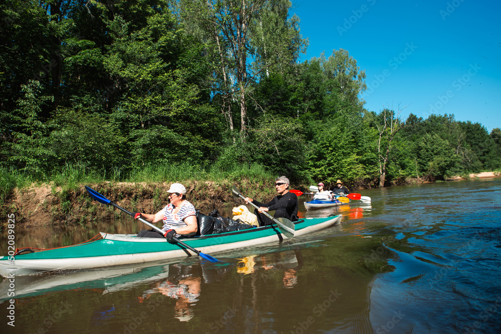 Family kayak trip. Man and woman and elderly couple senior and seniora ...