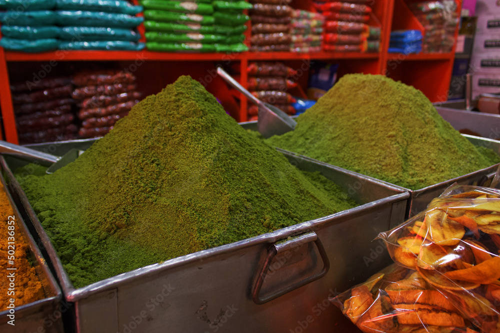 Powdered green mole on a tray in a store selling different types of ...