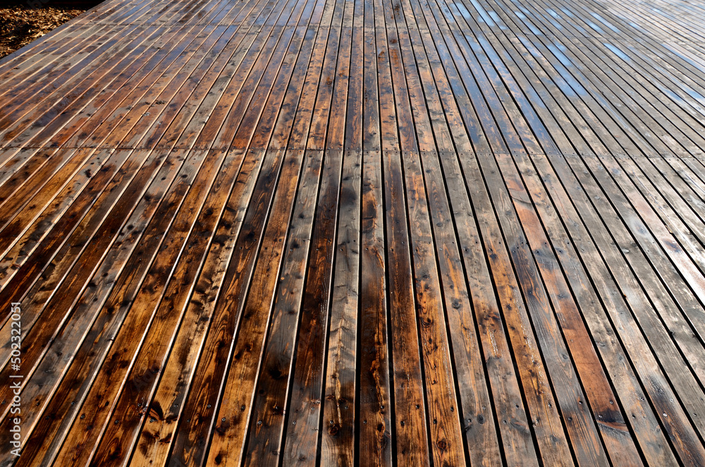 Impregnation of the terrace with oil paint. The color changes before ...