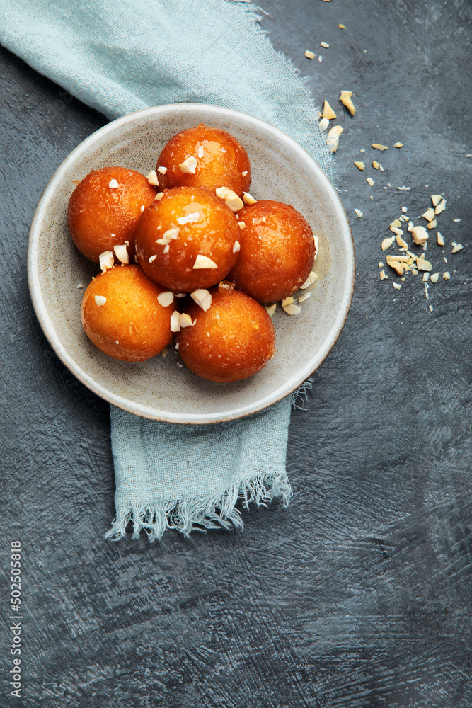 Gulab Jamun on gray background. Stock Photo | Adobe Stock