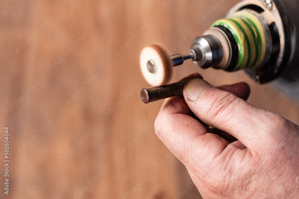 Restoration of an old Nagan revolver bullet case with a grinding ...