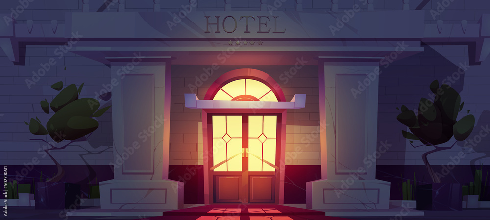 Luxury hotel building facade at night. Expensive hotel entrance on dark ...