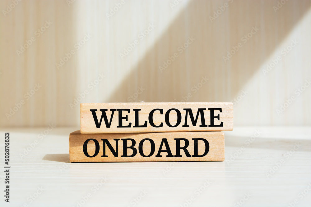 Welcome onboard symbol. Wooden blocks with words 'Welcome onboard ...