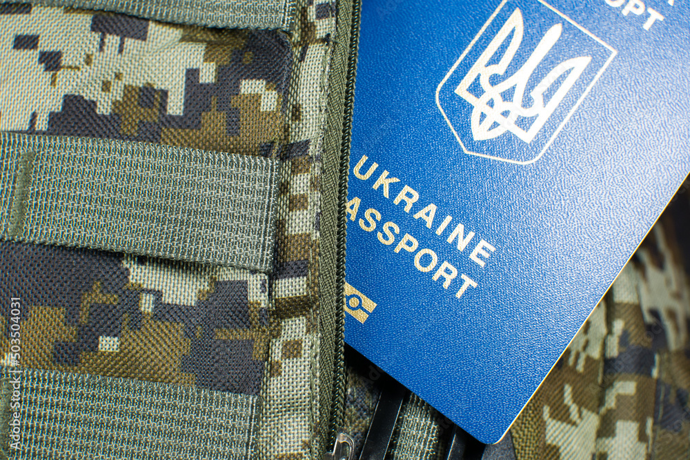 Ukrainian biometric passport on the military backpack. Ukrainian ...