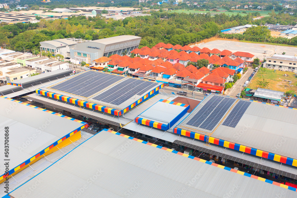Aerial view of solar panels or solar cells on the roof of shopping mall ...
