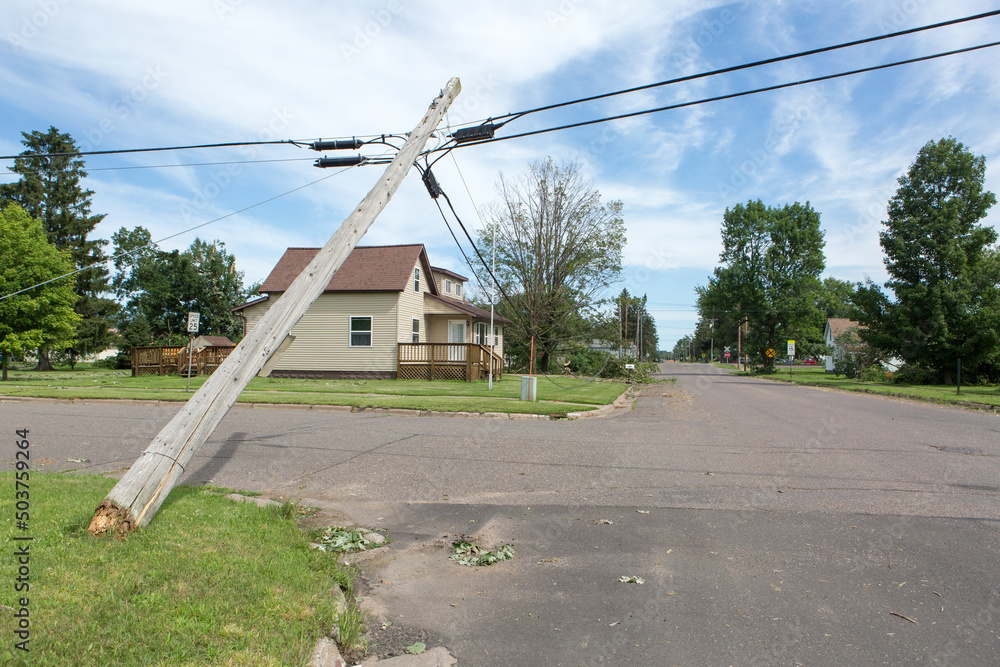 The storm caused severe damage to electric poles power lines over a road after Hurricane poles ...