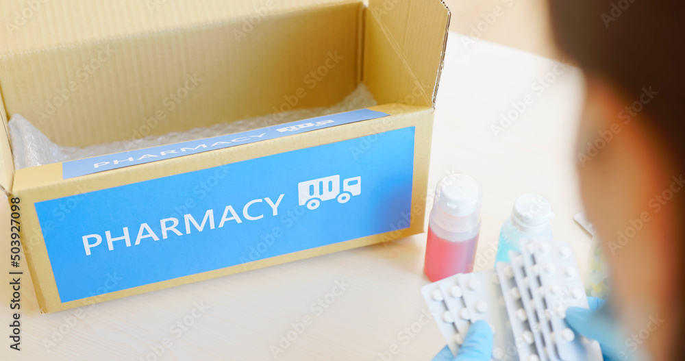 asian pharmacist pack medication Stock Photo | Adobe Stock