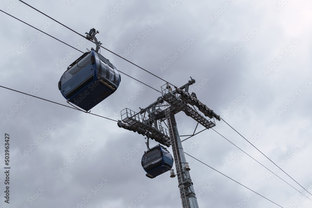 yellow cable car means of transport with a view of the city of bolivia ...