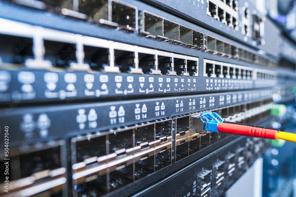 Optical patch cord cables connected to switch Stock Photo | Adobe Stock