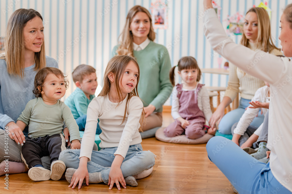 Parents taking part in the activities for preschool children. Healthy ...