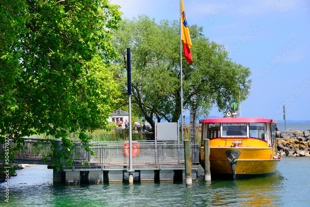 Geneva Mouette, yellow shuttle boat called water tram waiting at ...
