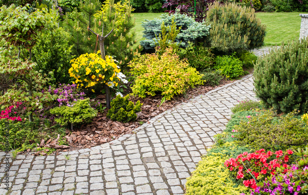 Winding granite path leading to the open garden. Entrance full of ...