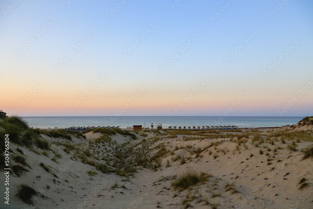 Foto Sunset at the supervised beach Cala Mesquida,Mallorca Island,Spain ...