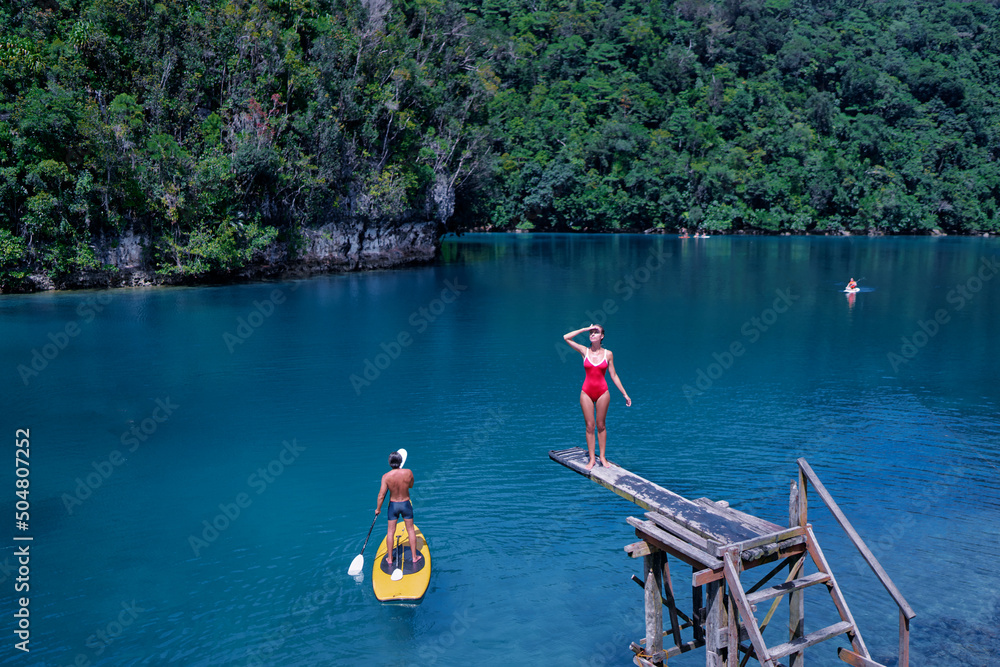 Sugba lagoon, tourists attraction. SUP Stand up paddle board. Blue sea ...