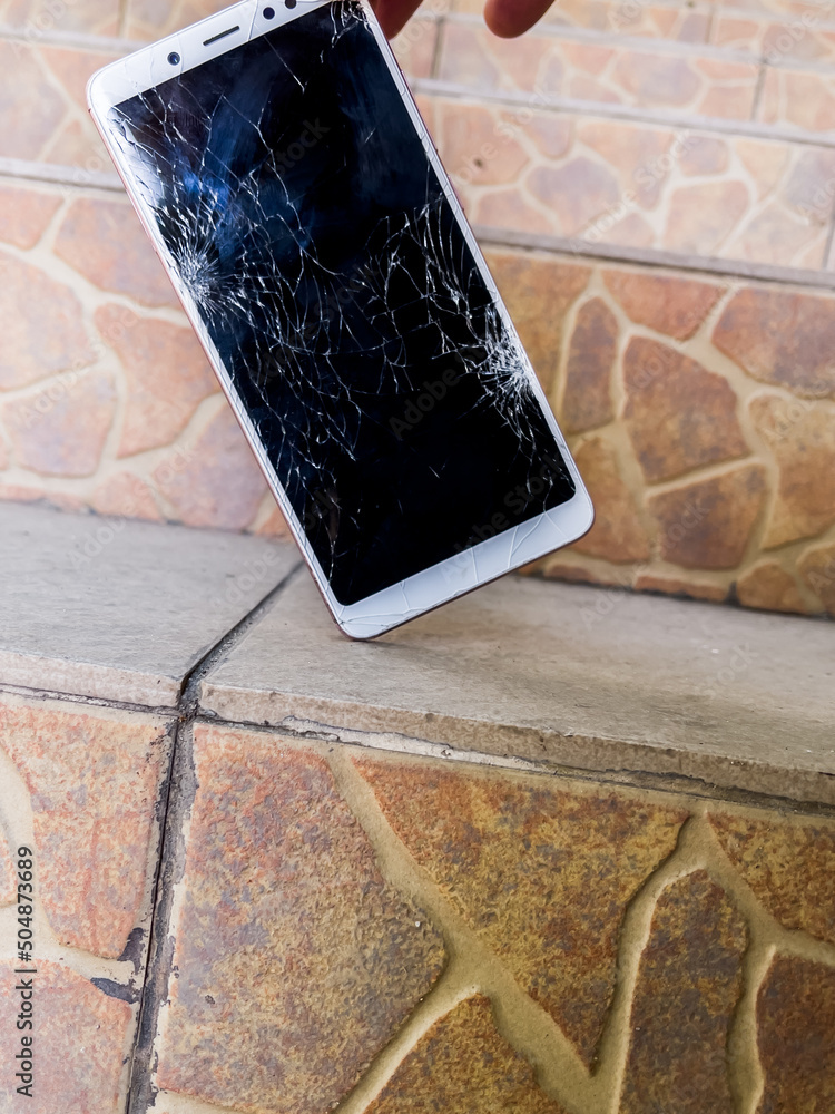 Smartphone with broken screen. cell phone or mobile with the split ...