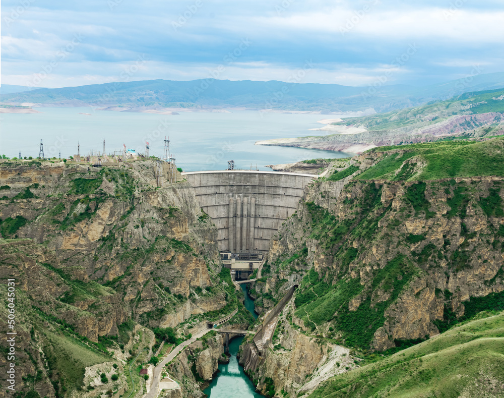 large arch dam of a hydroelectric power station on a river in a ...