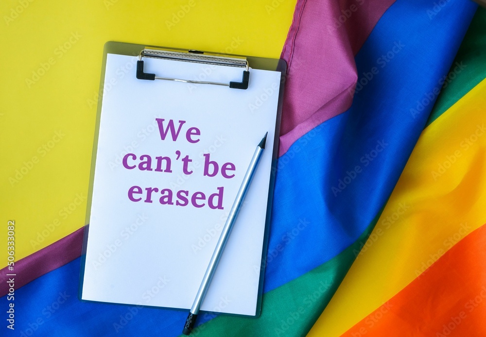 Photo Stock Rainbow flag with text WE CANT BE ERASED message paper note ...