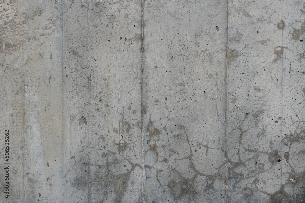 Reinforced concrete texture with areas covered with small cracks and ...