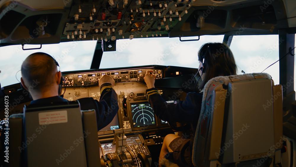 Team of aviators throttling power engine and fixing altitude level ...