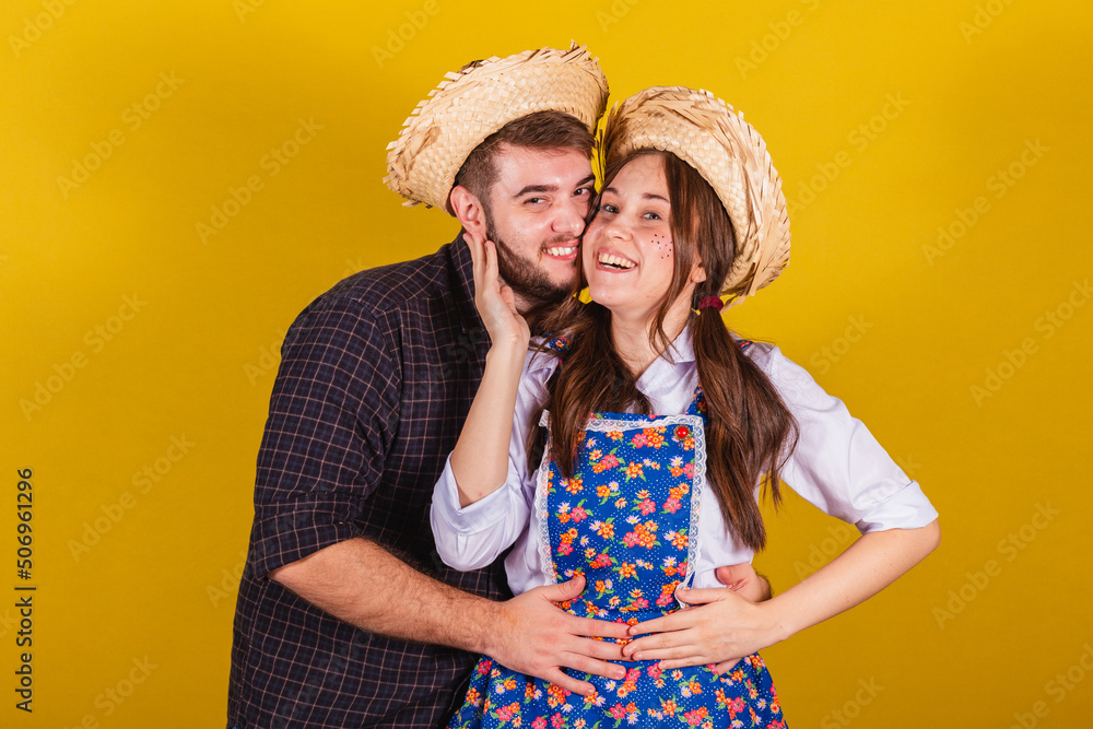 Beautiful couple wearing typical clothes for the Festa Junina. together ...
