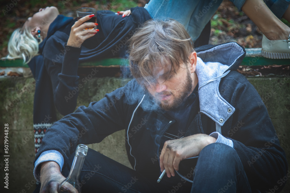 Couple of man and woman drinking vodka. Drunk young people. Alcoholism ...