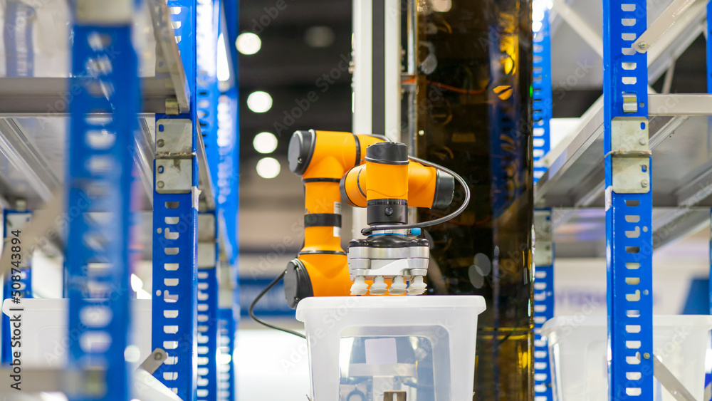 Smart warehouse concept: The COBOT (Collaborative Robot) with gripper ...