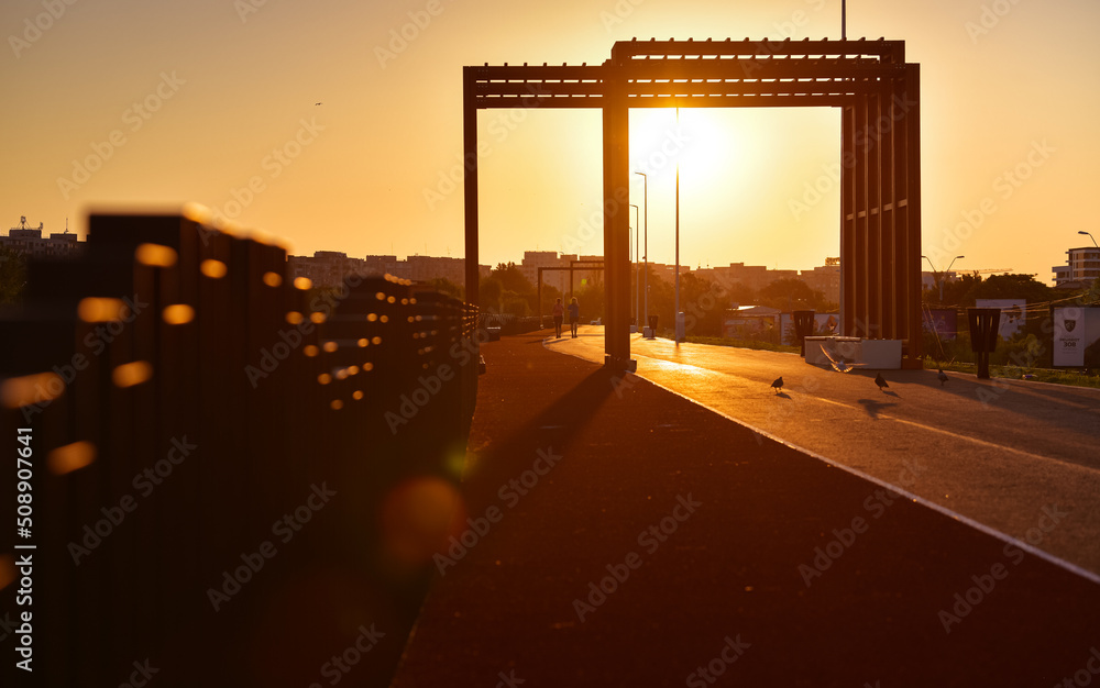 Sunrise in Bucharest. A beautiful morning in the new park promenade ...