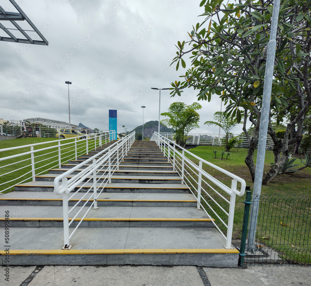 marina harbor boat grass cloudy sky clouds ladder taxi car parking ...