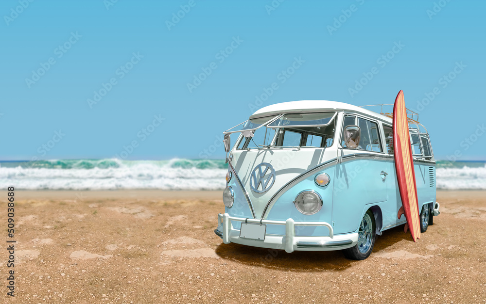 Vintage 1966 Volkswagen Bus with surfboard at the beach, front view ...