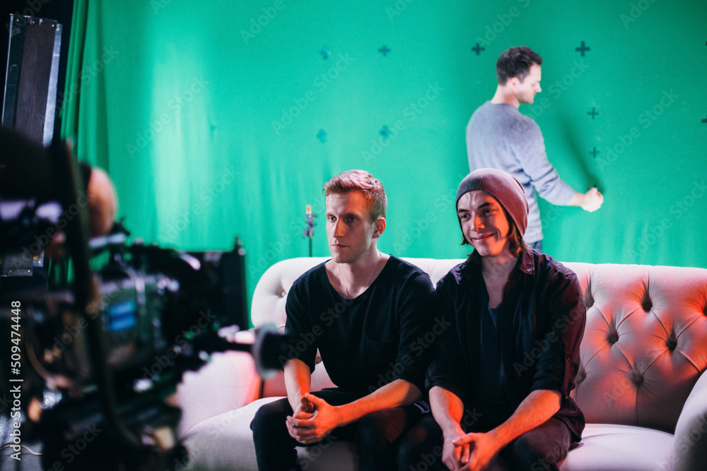 Professional male actors work in the frame on the set. Shooting with ...