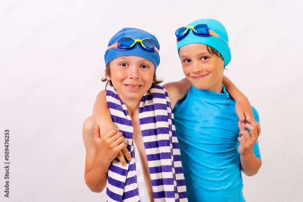 Brothers dressed and hugged in their swimsuits for swimming lessons in ...