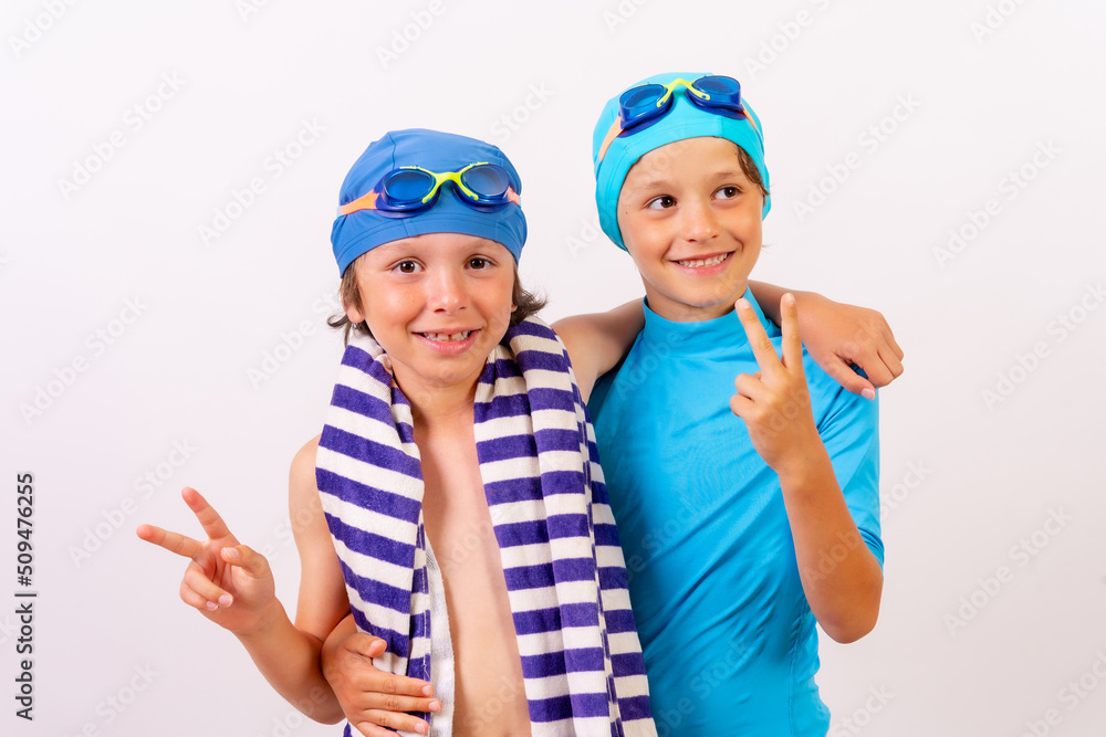 Brothers dressed and hugged in their swimsuits for swimming lessons in ...