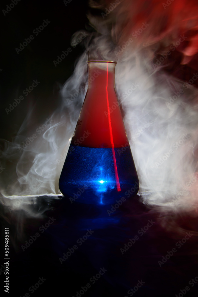 Chemical reaction with a lot smoke and vapors inside Erlenmeyer flask ...