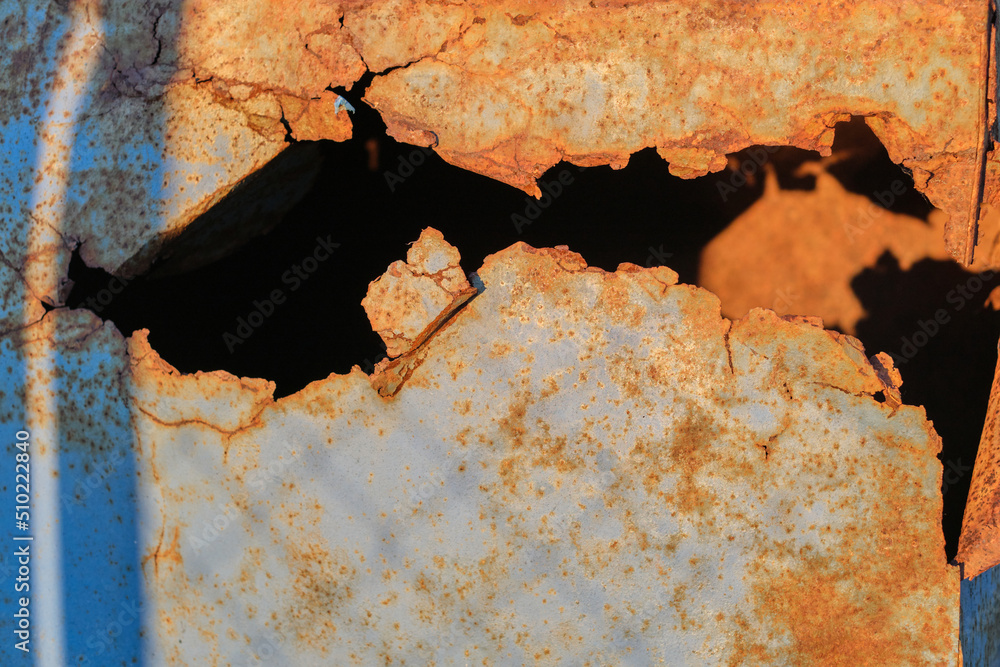 Fragment of rusty metal sheet. After many years of operation, corroded ...