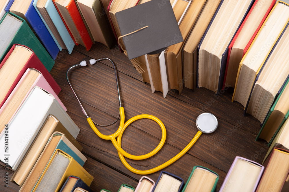 Medical degree education concept - stack of books in heart shape and ...