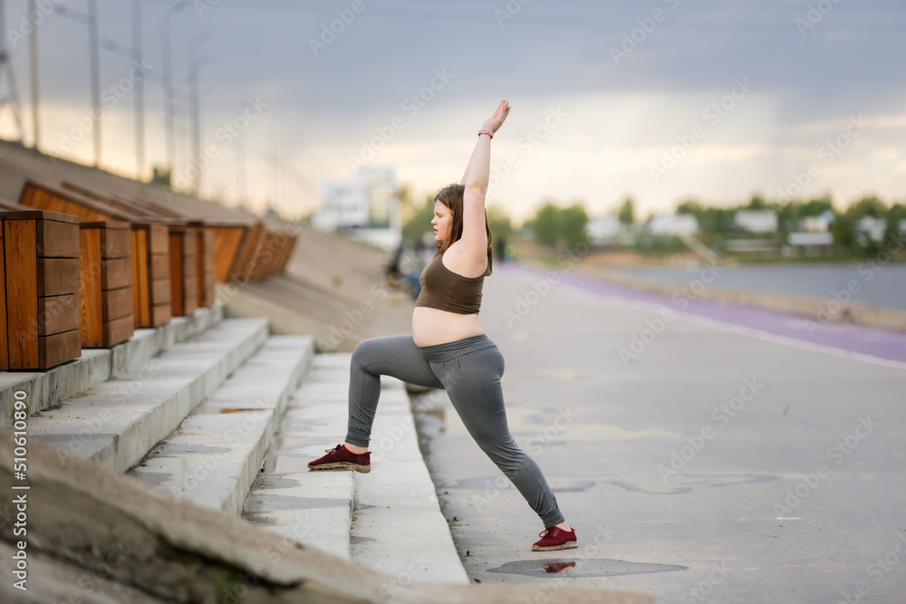 Overweight kid teen training and exercise at park town on stairs ...