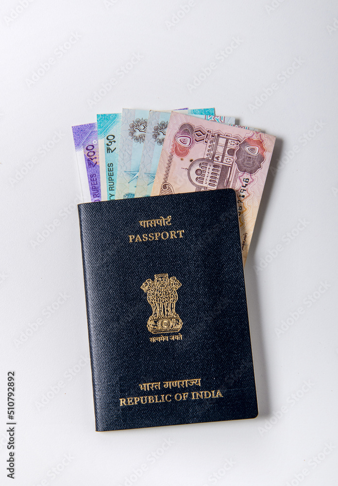 Currency notes UAE and India placed in the Indian passport booklet to n ...